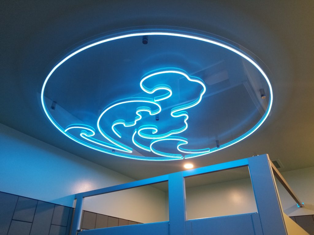 Ceiling-mounted LED (neon look) Blue “Wave” Sign @ Kinjo North Hill ...